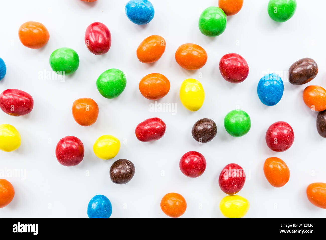 Candy lying on white background. Bright and Colorful sweets top view ...