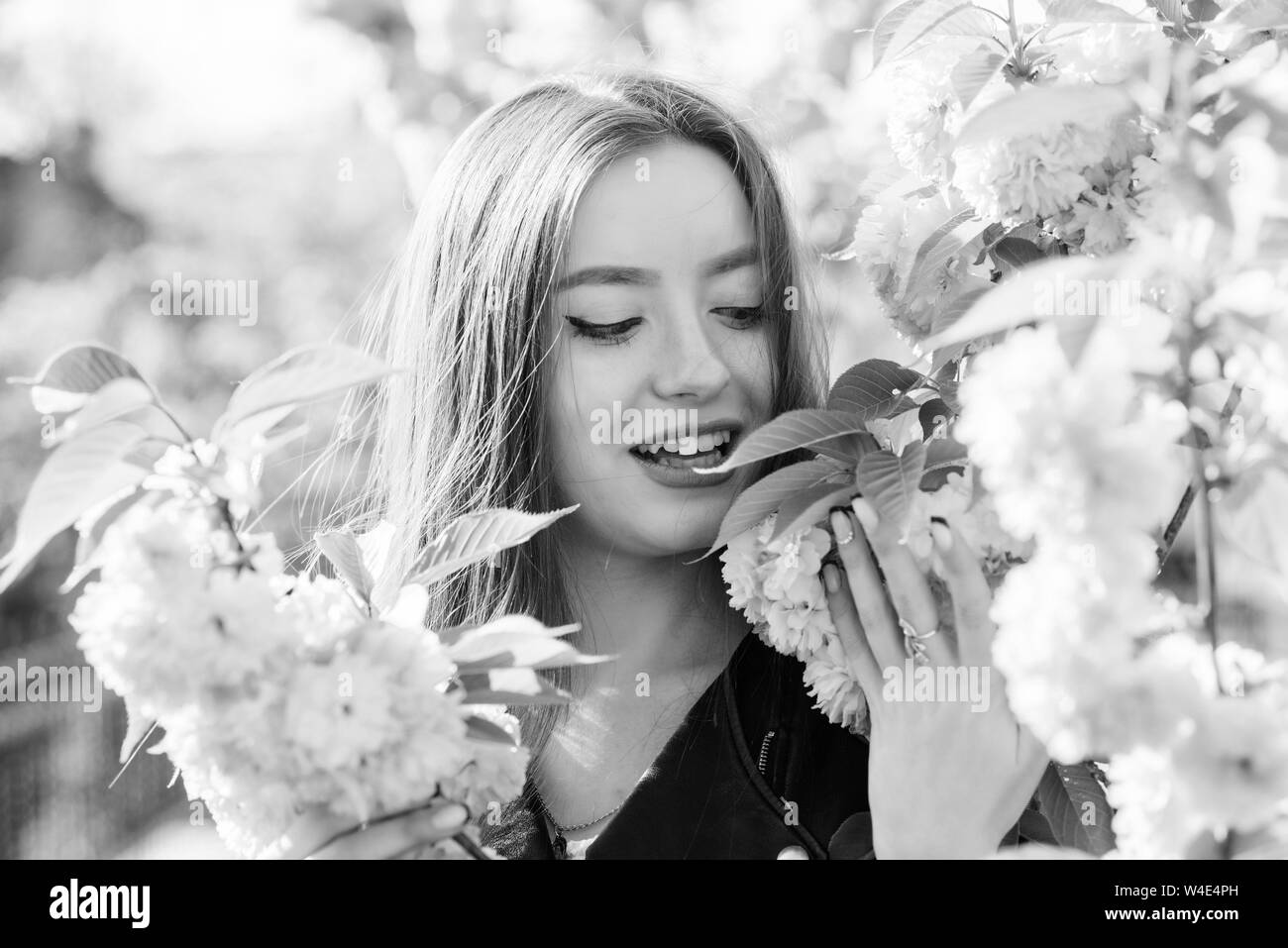 Skincare and spa. Natural cosmetics for skin. Girl in cherry blossom ...