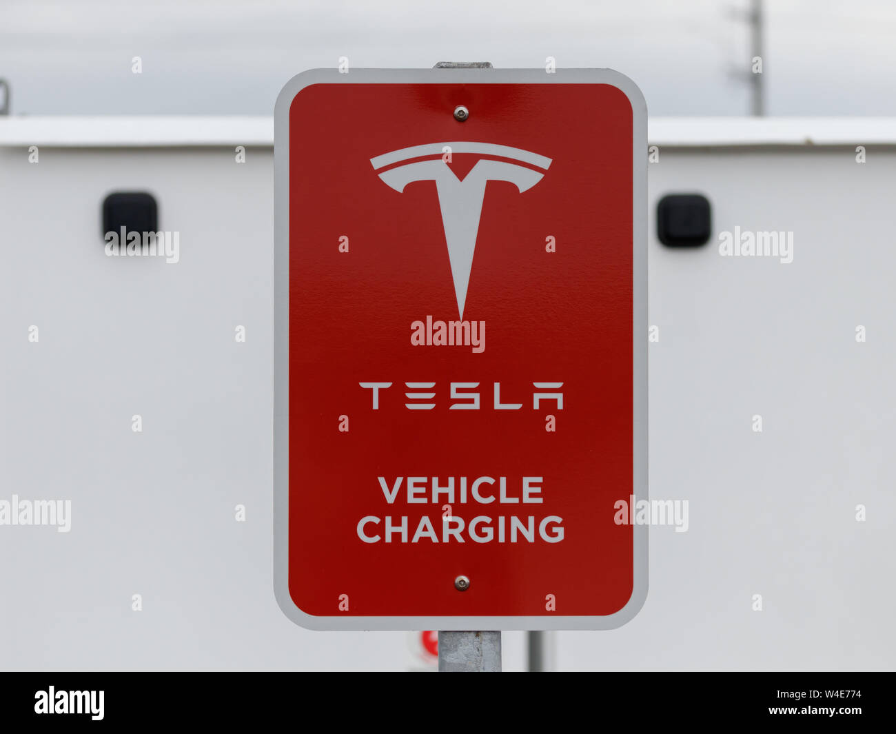 Tesla Vehicle Charging sign Stock Photo - Alamy