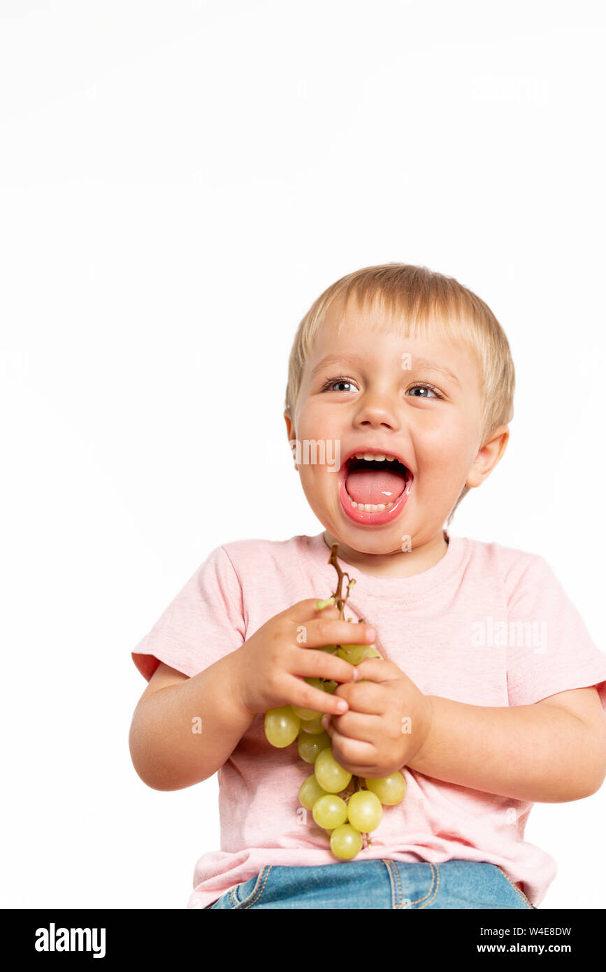 Boy eating grapes child hi-res stock photography and images - Alamy