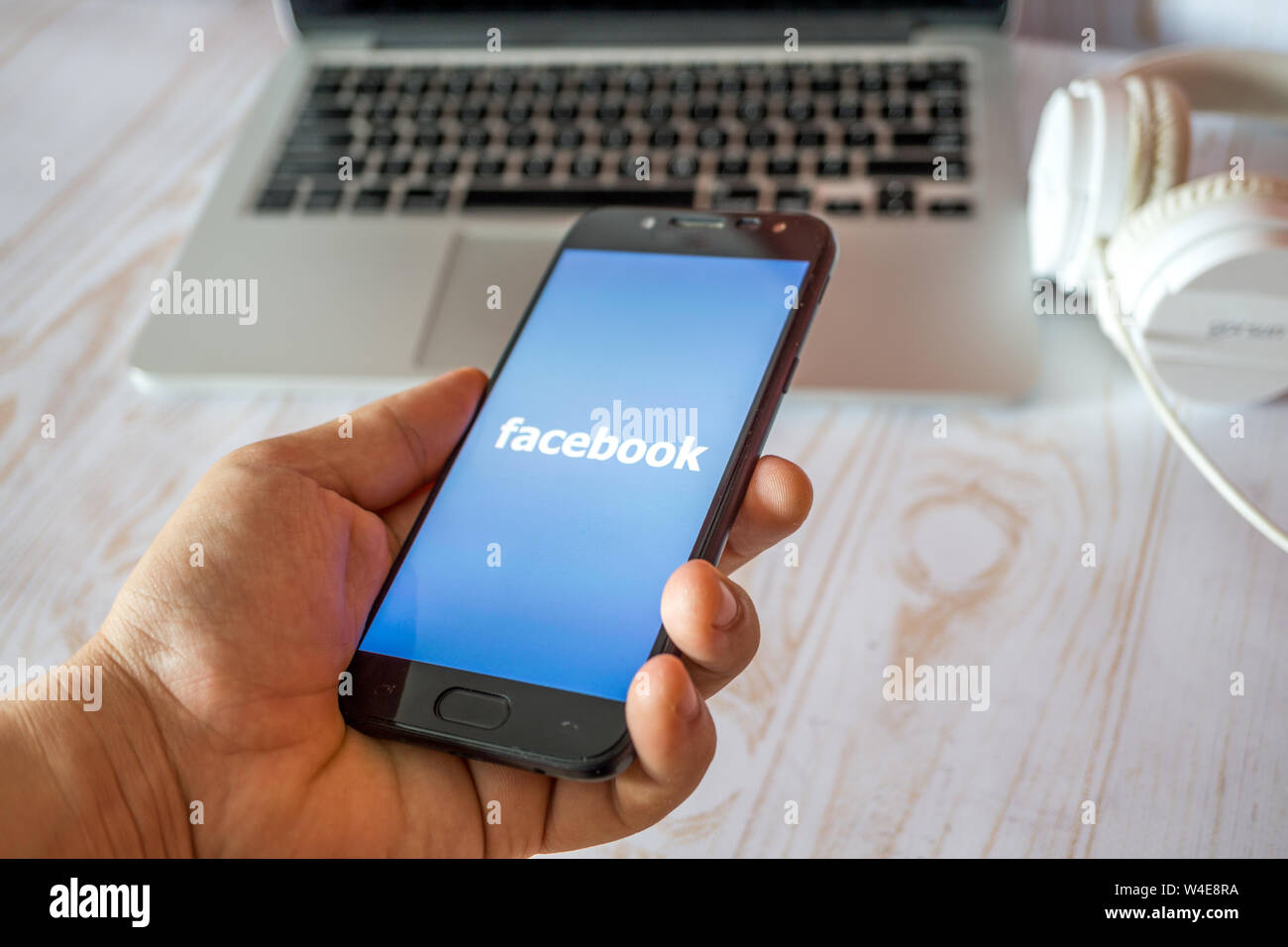 Nizhyn, Ukraine/July-16-2019: Young man in black suite hold smartphone ...