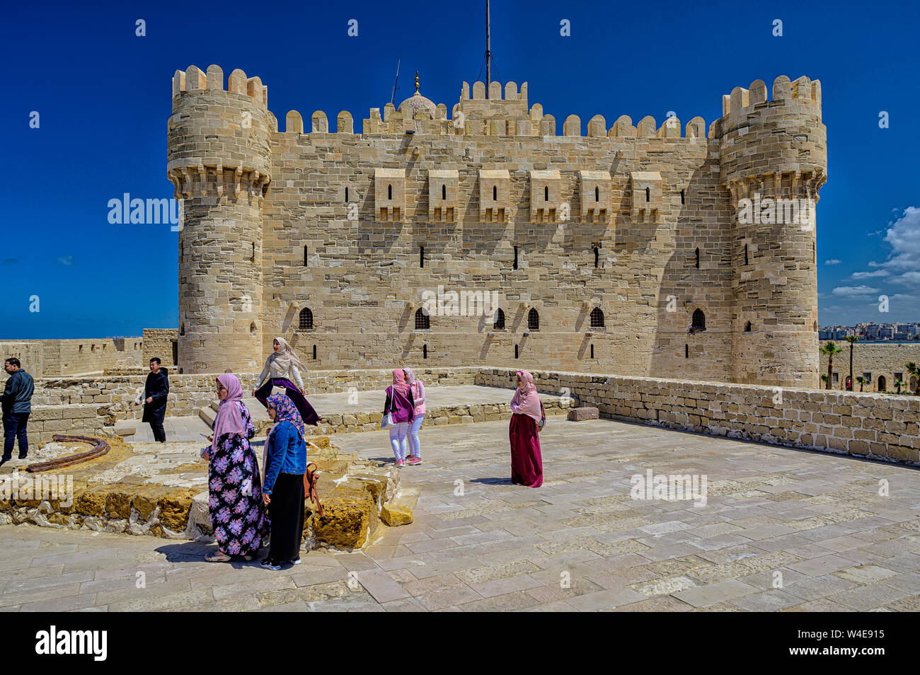 Tourists enjoy the views of Fort and city from the outer walls of ...