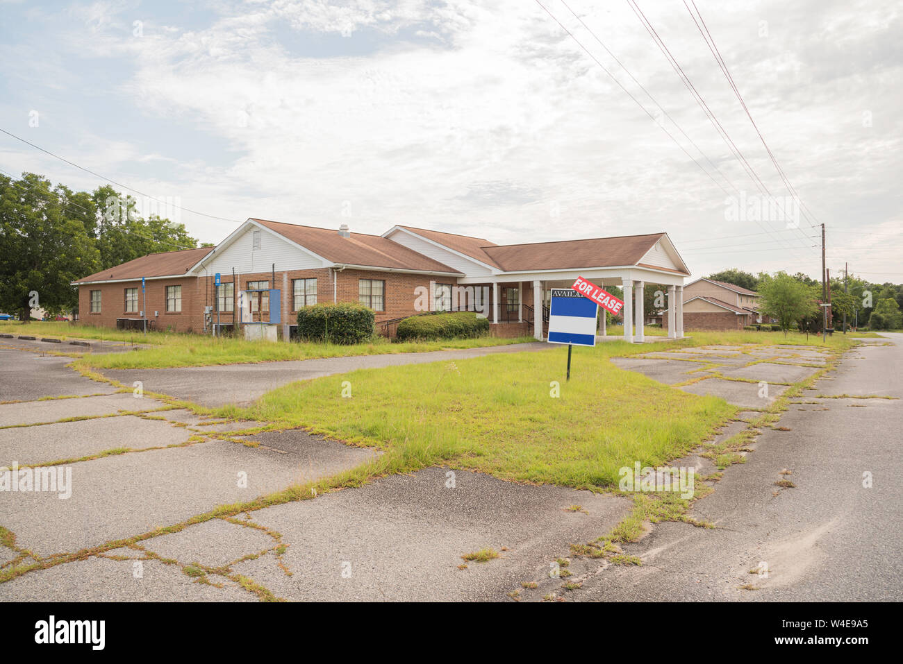 A rundown residential and commercial property in a suburban area with a ...