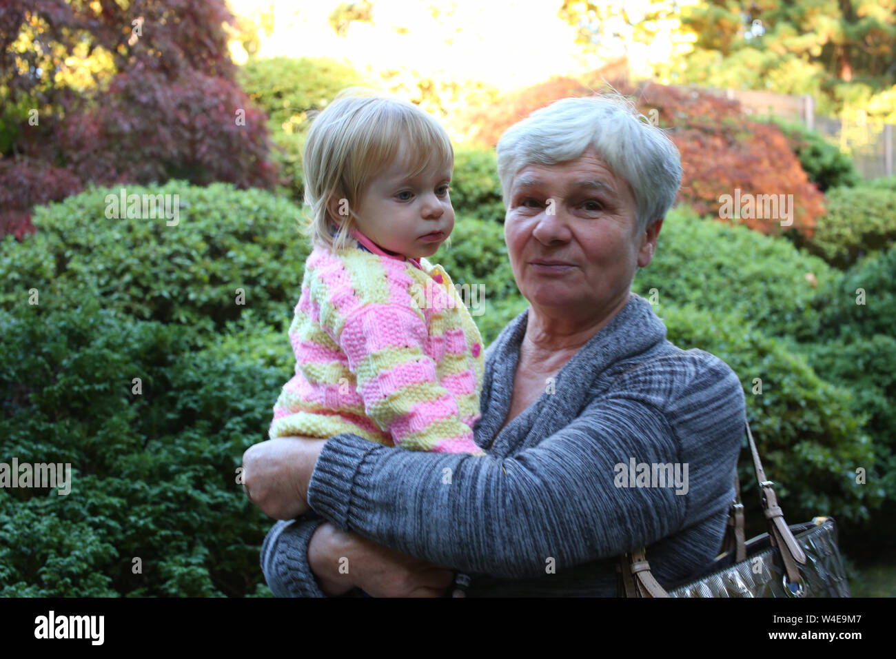 Beautiful Grandmother playing with her Cute Granddaughter Stock Photo ...