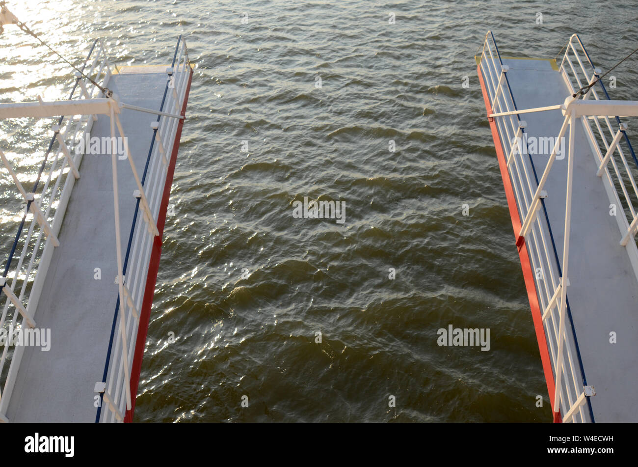 OVERBOARD: The boarding walkways on a riverboat cruise hang out over ...