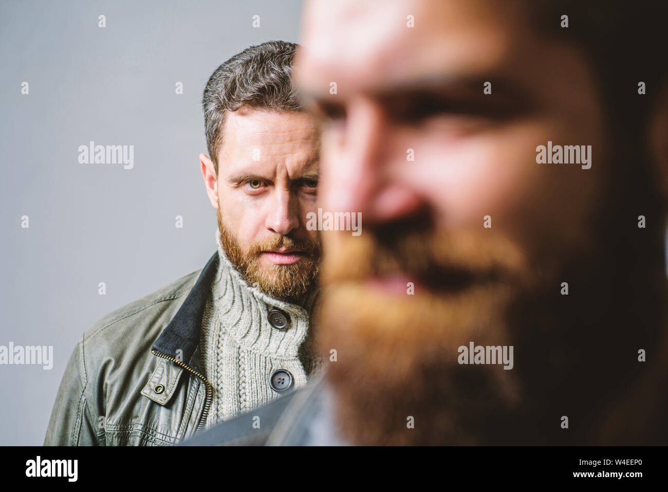 Man bearded guy stand behind back of friend hipster. True friend always ...