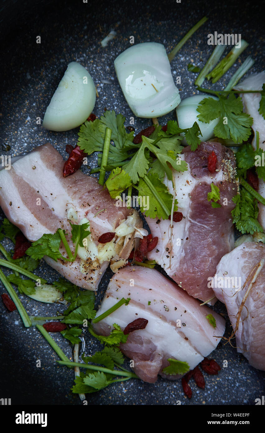 Raw pork with spice in the pot Stock Photo - Alamy
