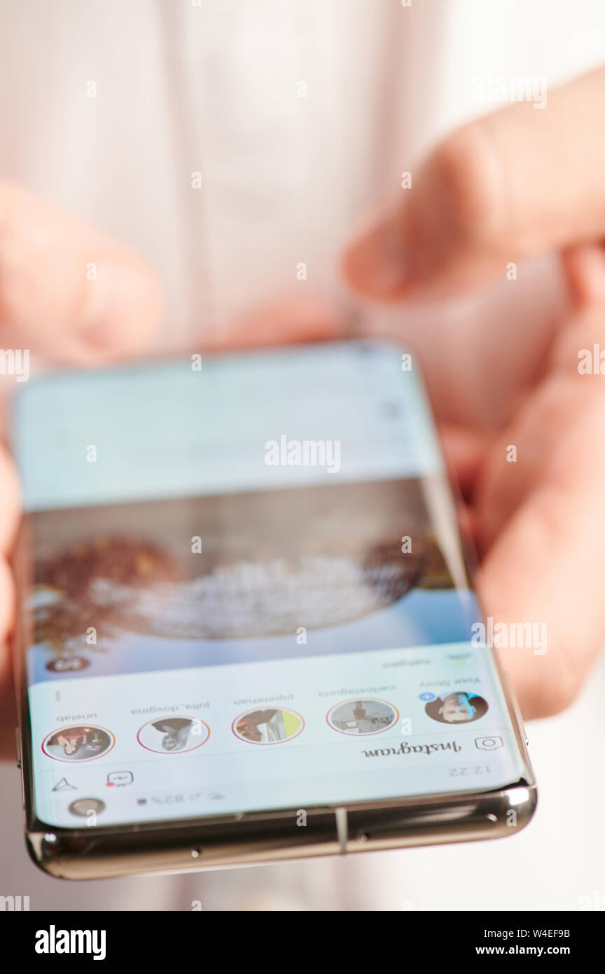 New york, USA - july 22, 2019: Using instagram mobile app close up view ...