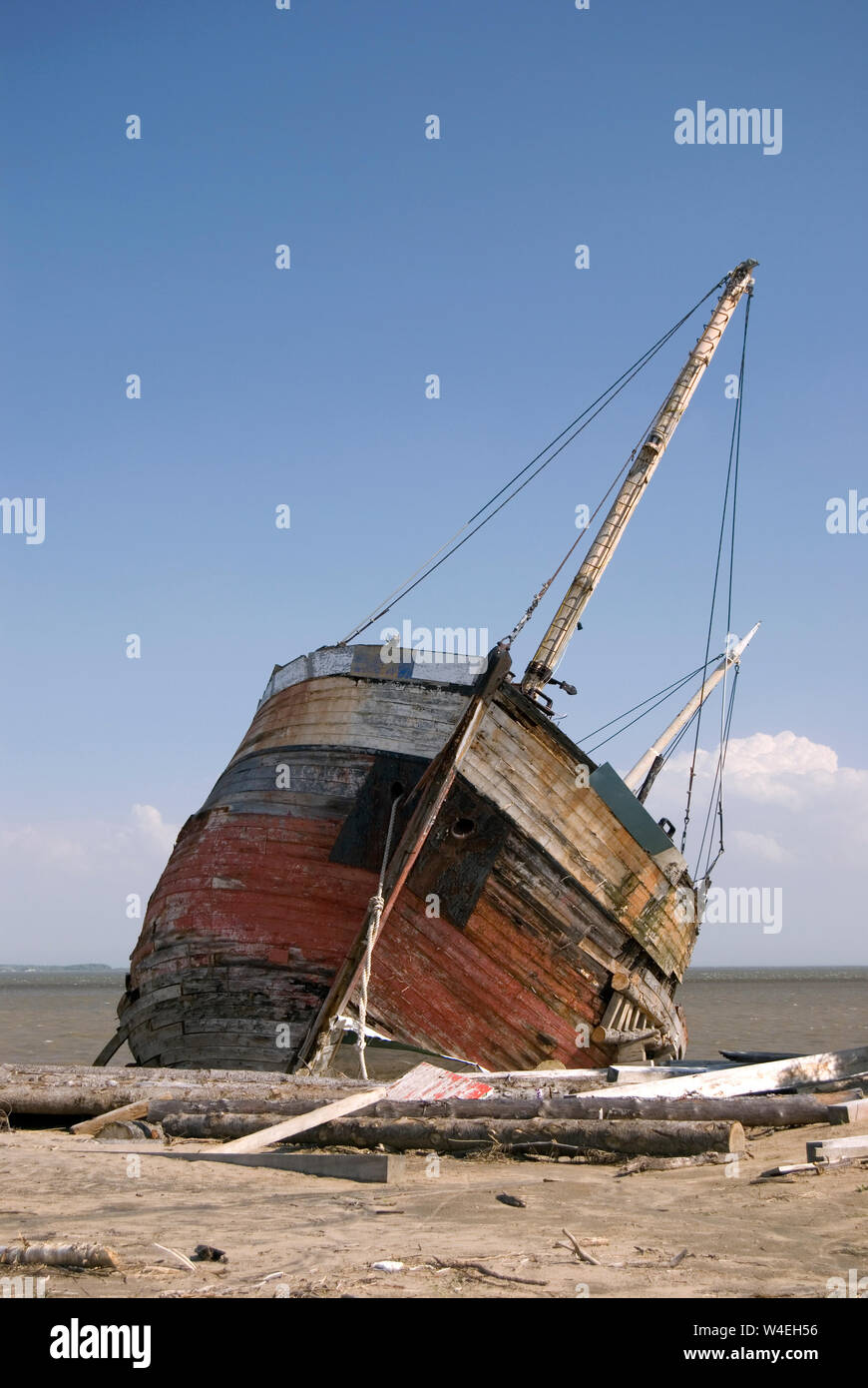 Shipwreck on a Beach in Baie St-Paul Quebec, Canada with Blue Sky Stock ...