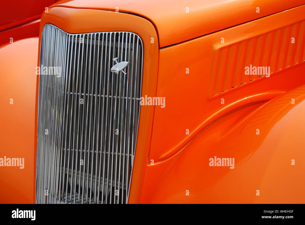 Beautiful Front Grill on a Vintage Orange Hot Rod Stock Photo - Alamy