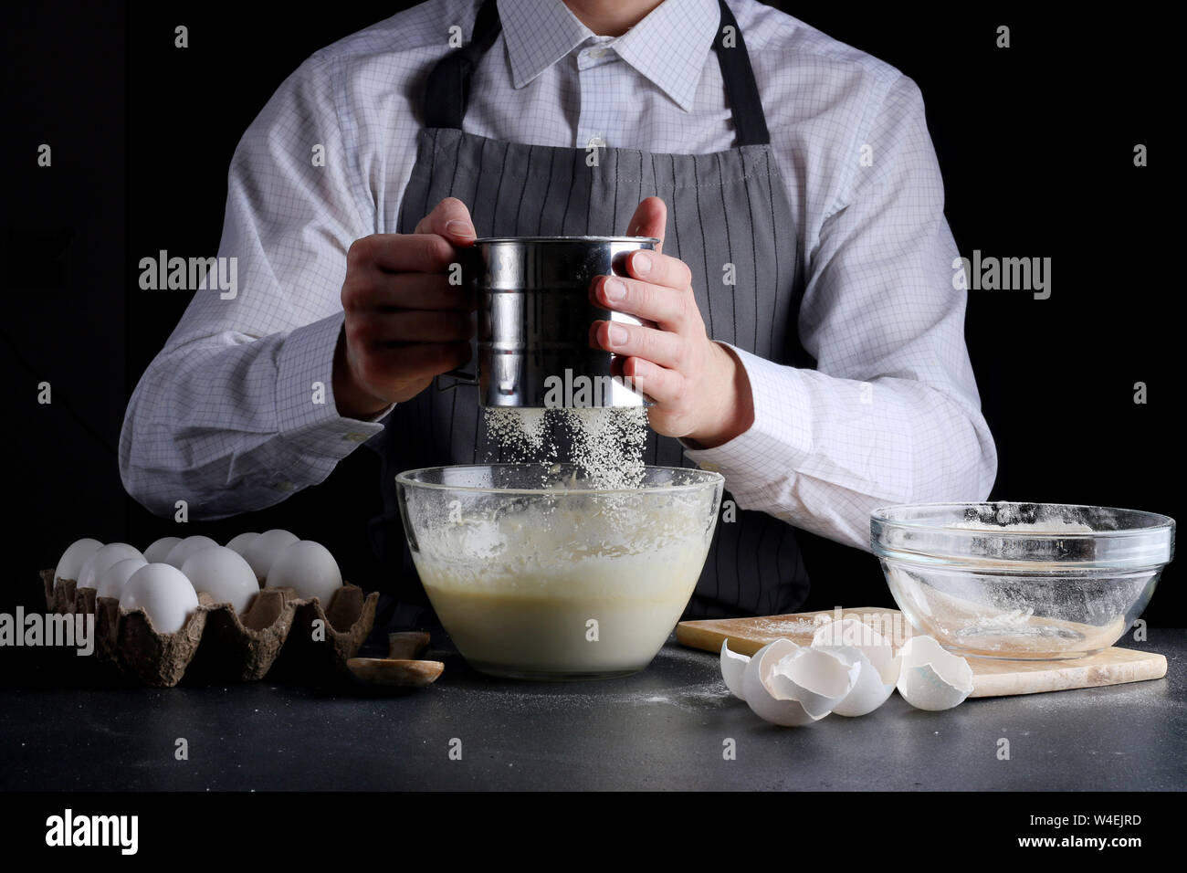 Man hands pouring flour in hi-res stock photography and images - Alamy