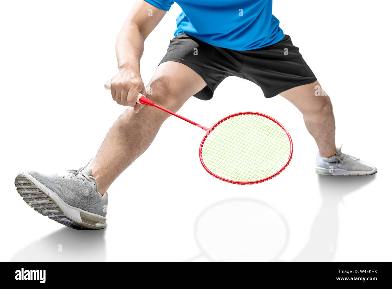 Man playing badminton with badminton racket isolated over white ...