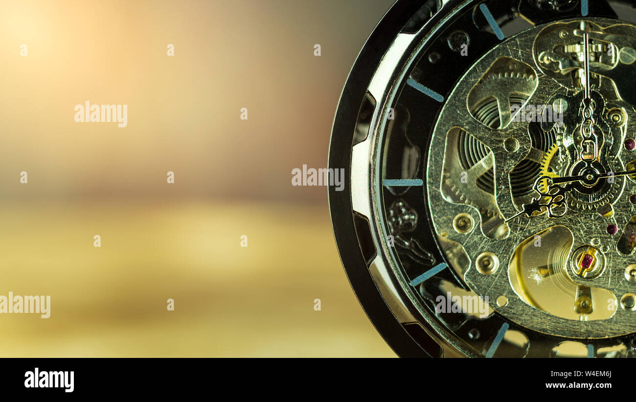 Closeup pocket watch on table and sunlight. At 8 am. o'clock in the ...