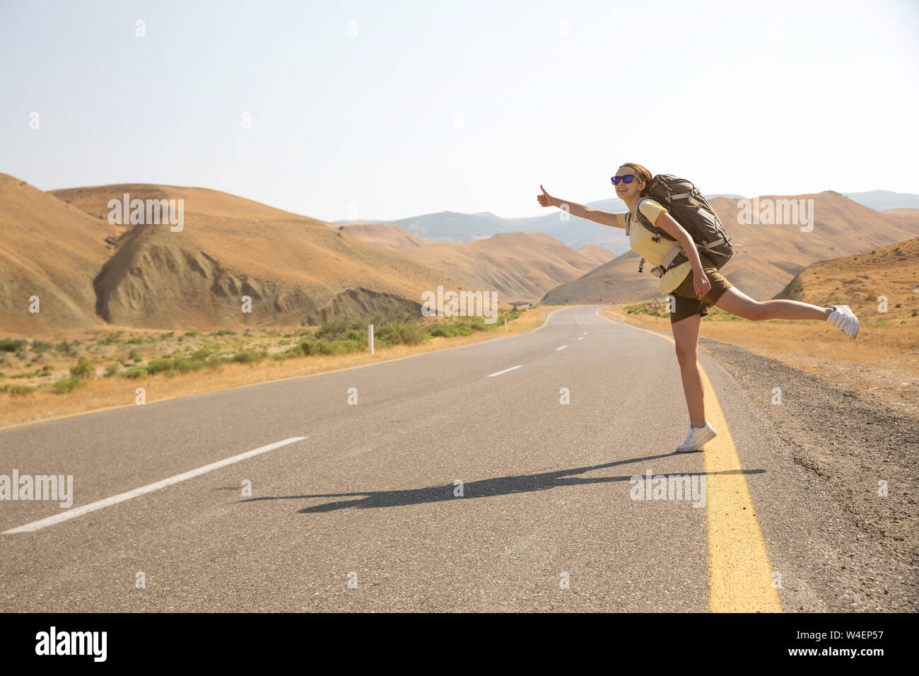 Hitchhiker Traveler Woman On The Road In Sunset Girl Traveler Hiker On The Road Summer