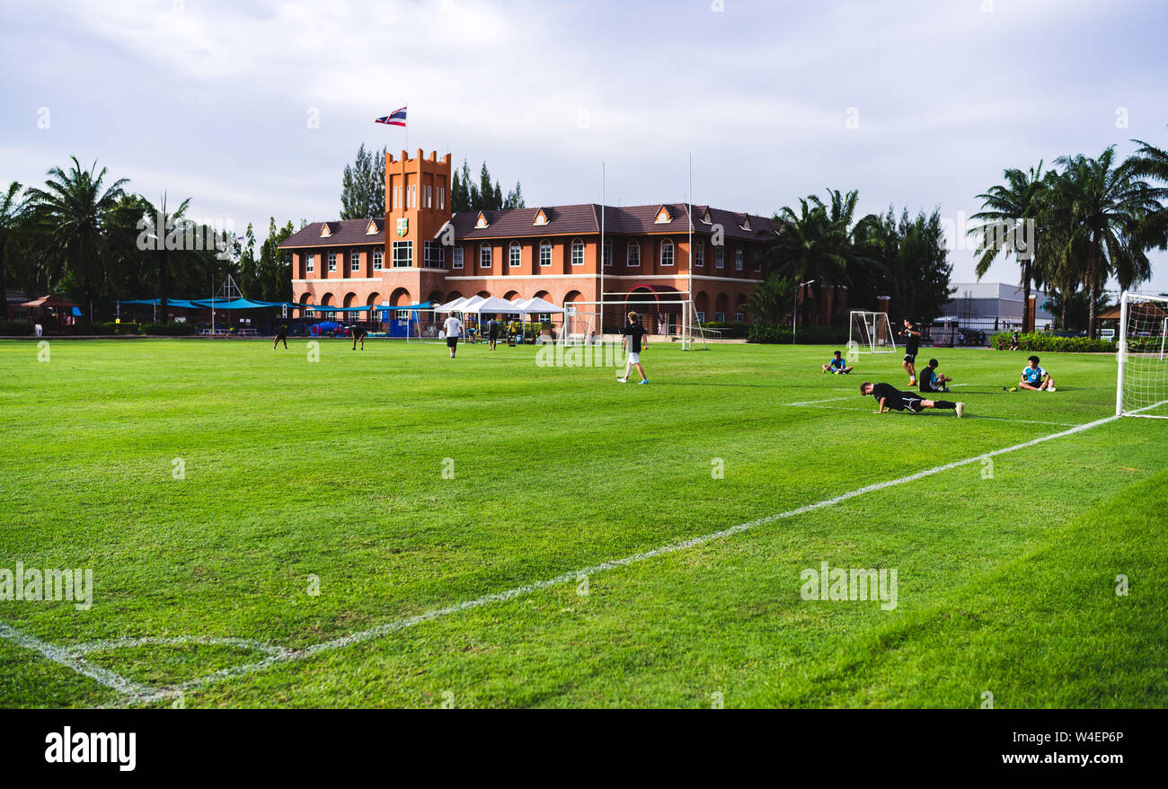 Football field at International school with students warming up and ...