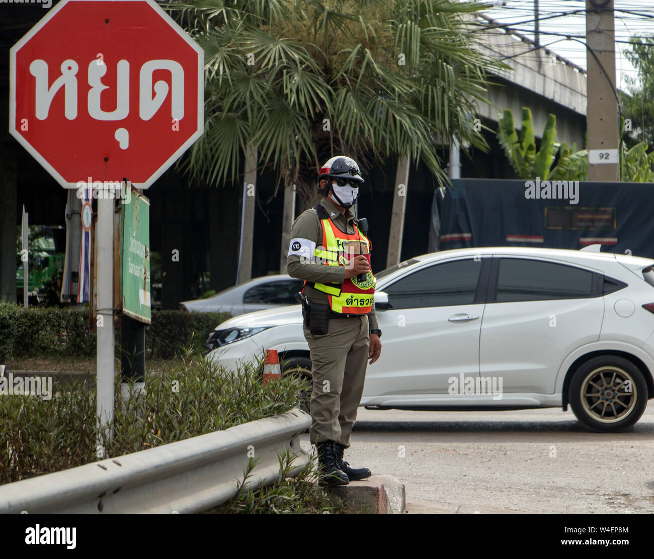 Asian directing traffic intersection hi-res stock photography and ...