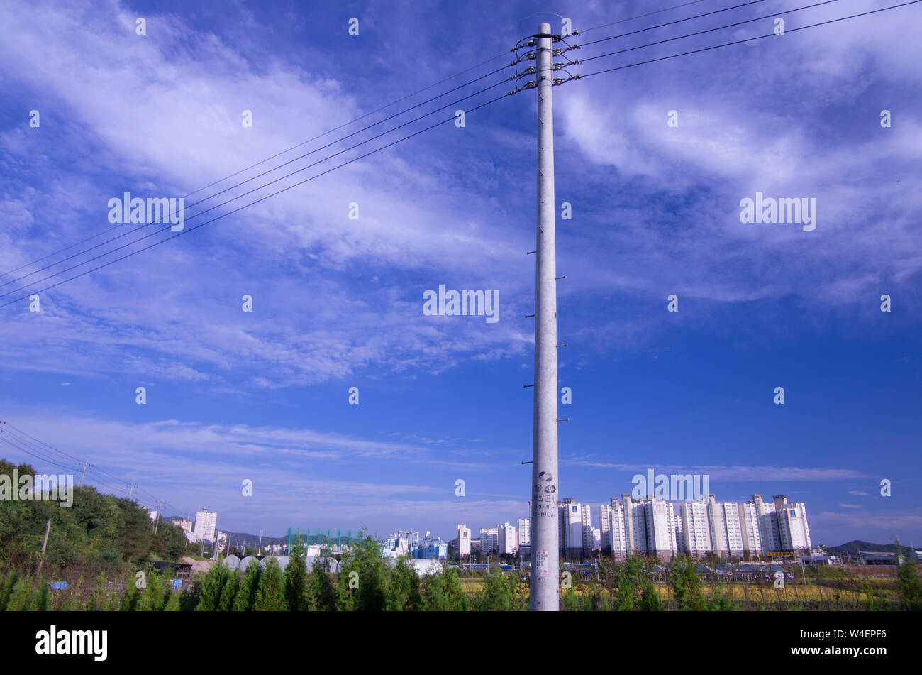 utility pole with cable under blue sky Stock Photo - Alamy