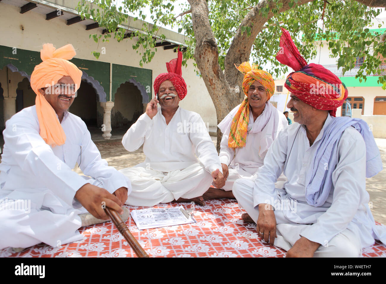 Group of rural people sitting together Stock Photo - Alamy