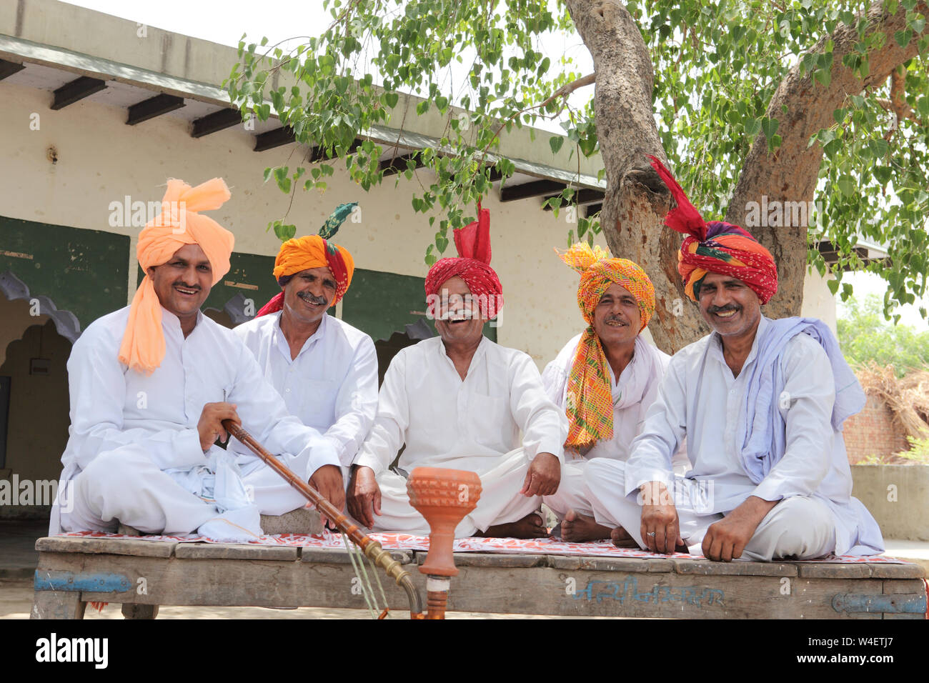 Group of rural people sitting together Stock Photo - Alamy