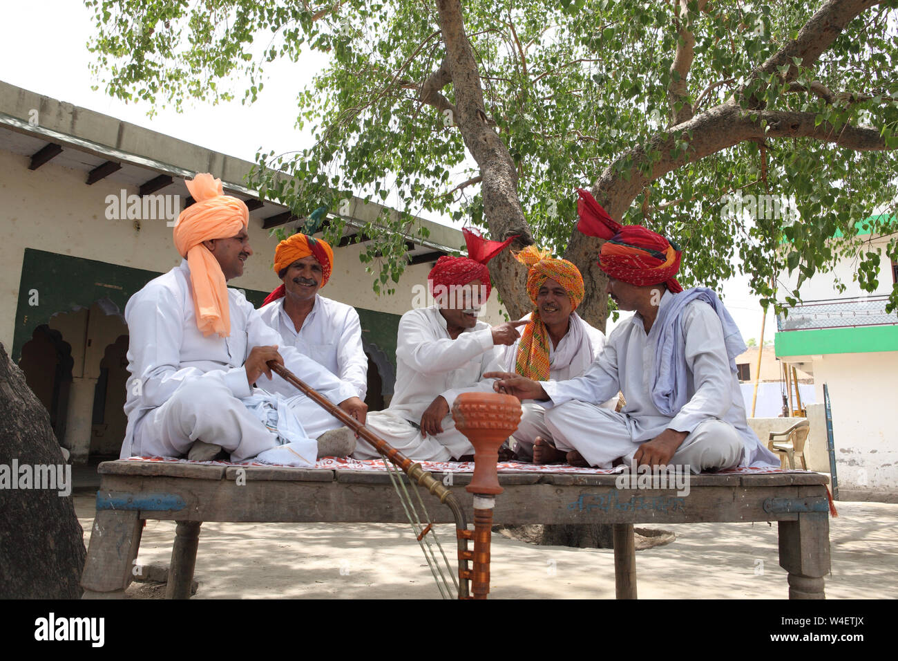 Group of rural people sitting together Stock Photo - Alamy