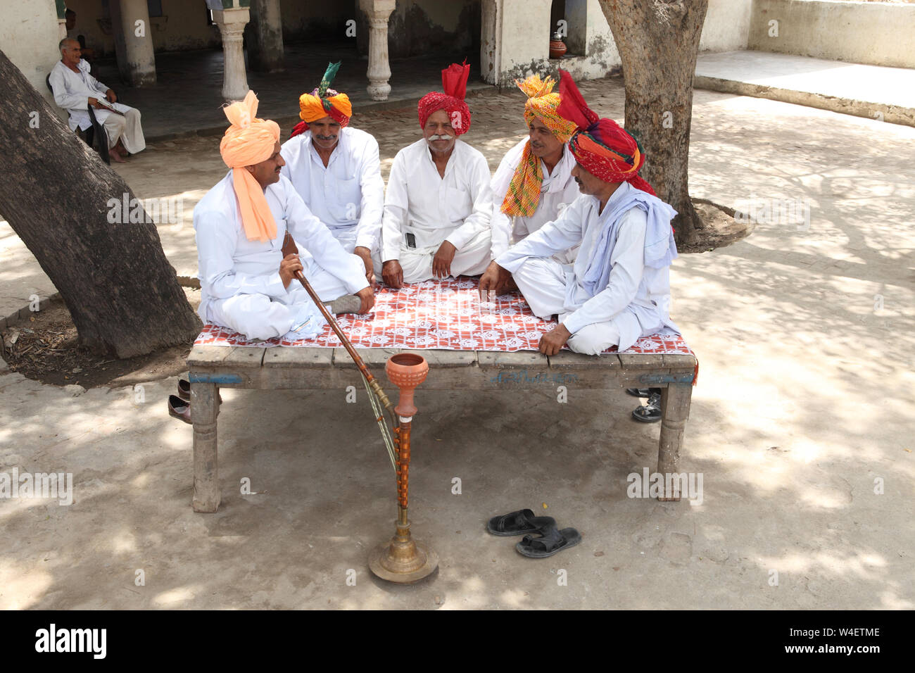 Group of rural people sitting together Stock Photo - Alamy