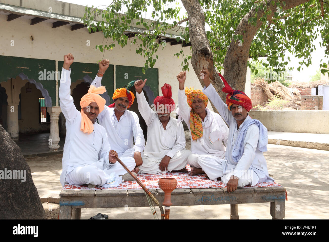 Group of rural people sitting together Stock Photo - Alamy