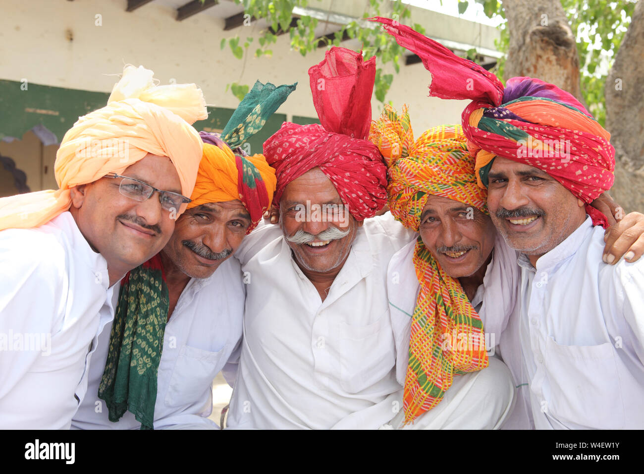 Group of rural people sitting together Stock Photo - Alamy
