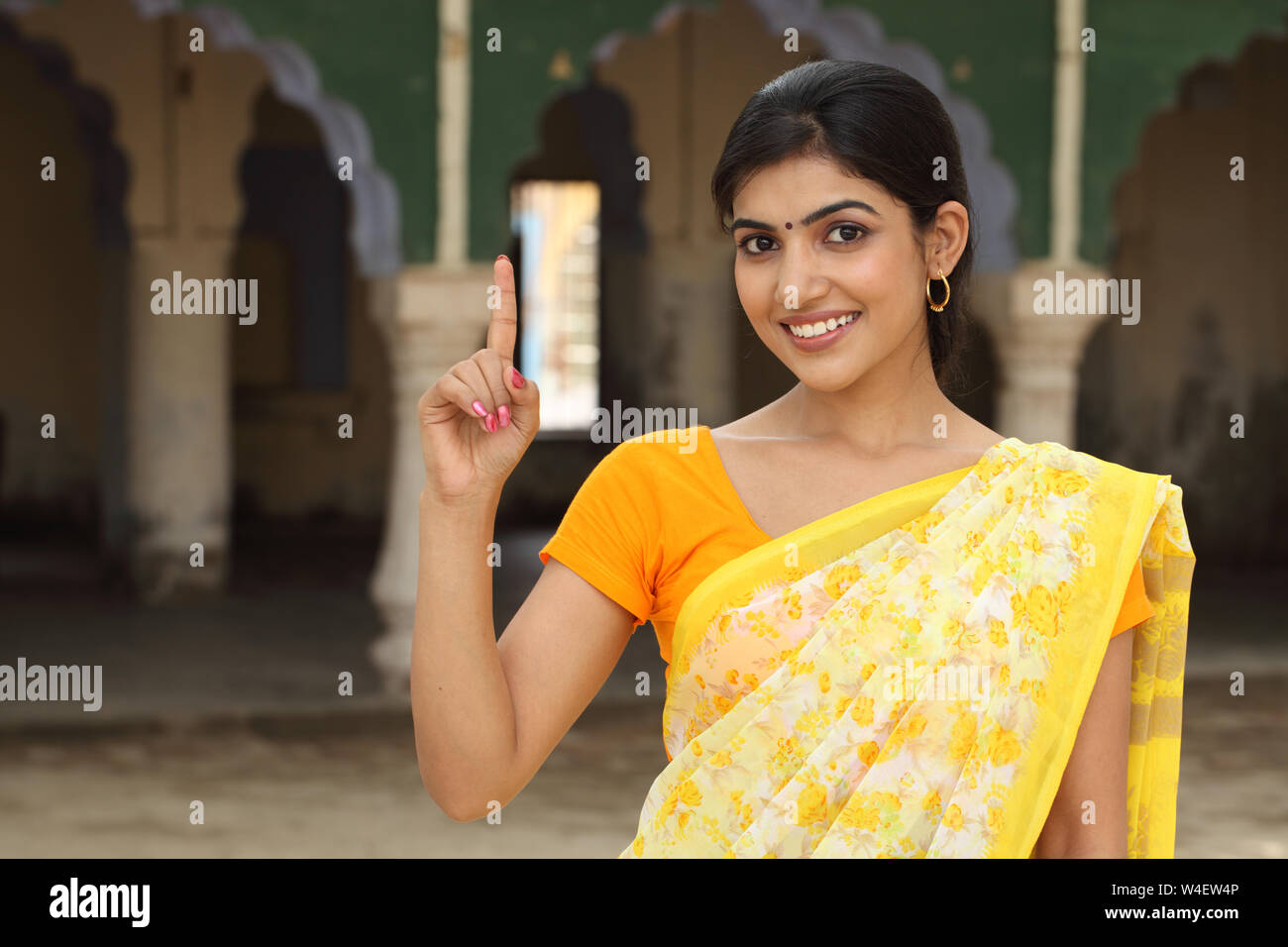 Indian woman showing pointing upward hi-res stock photography and ...