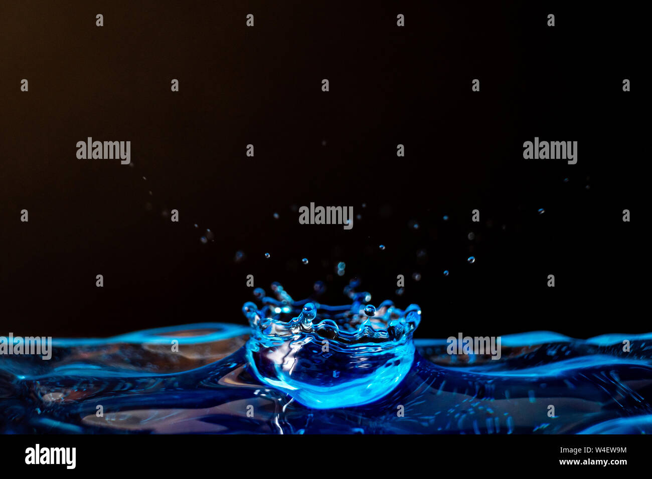 Drop of water, blue water drop, water splash close-up isolated on black ...