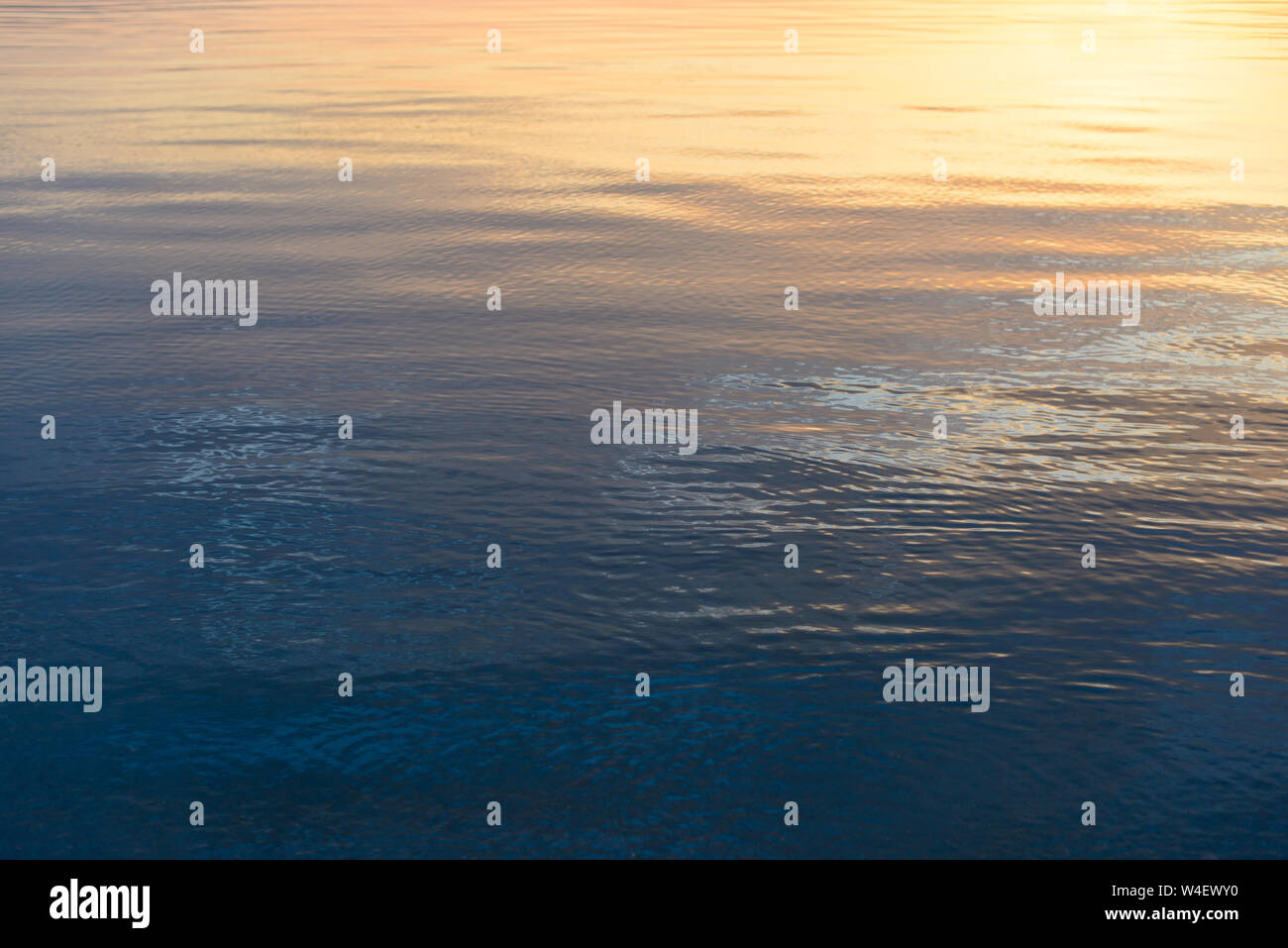 Colorful yellow and blue water surface with ripples on the sea Stock ...