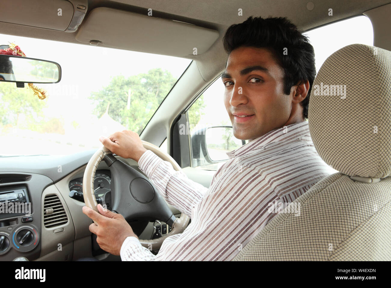 Indian man sitting inside car hi-res stock photography and images - Alamy