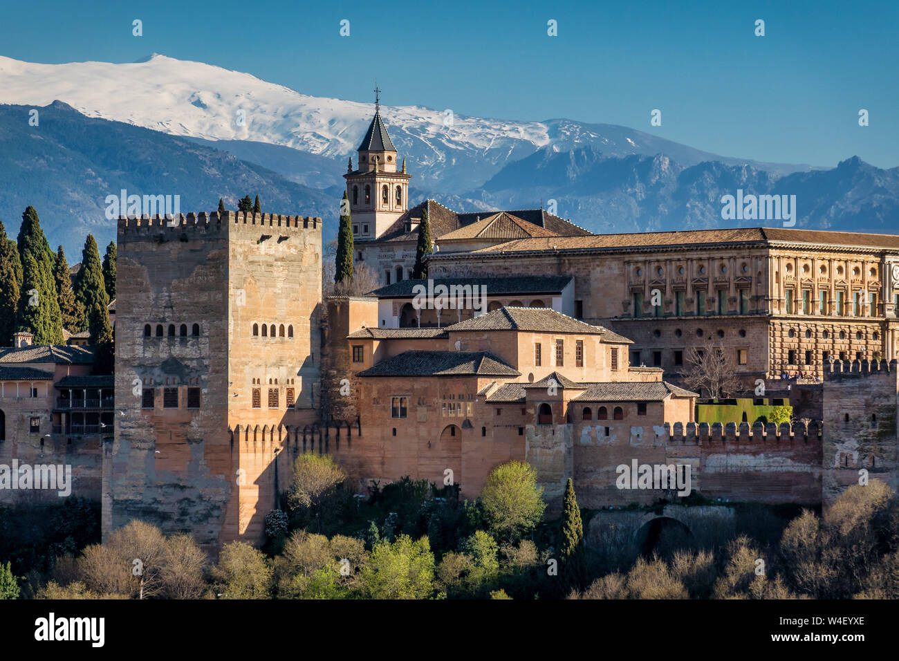 View of Alhambra Palace in Granada, Spain with Sierra Nevada mountains ...