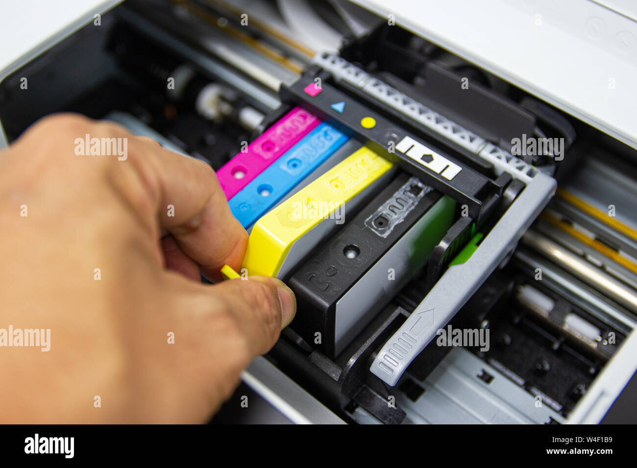 Close up Technicians are installing the color printer inkjet cartridge ...