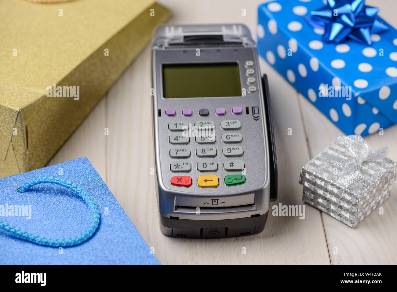 Payment terminal and gift boxes Stock Photo - Alamy