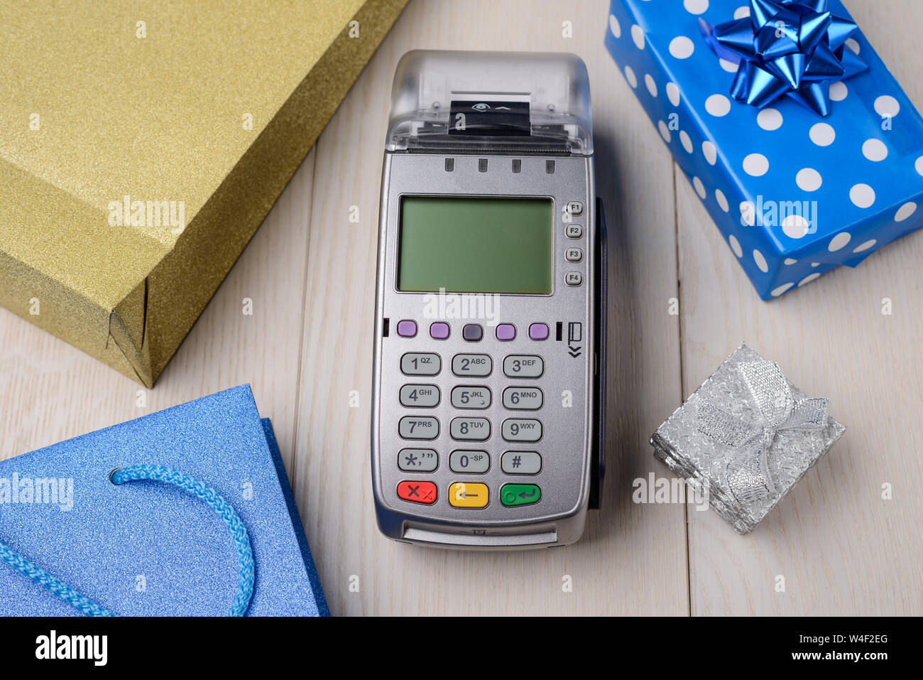 POS terminal between gift boxes Stock Photo - Alamy