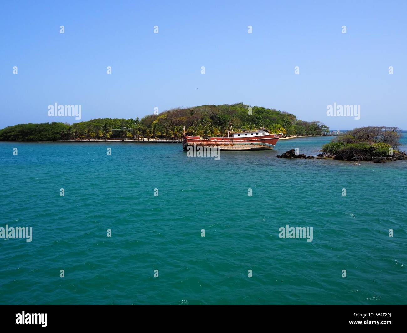 Ship wreck and island off of Roatan and Utila Bay Islands in the ...