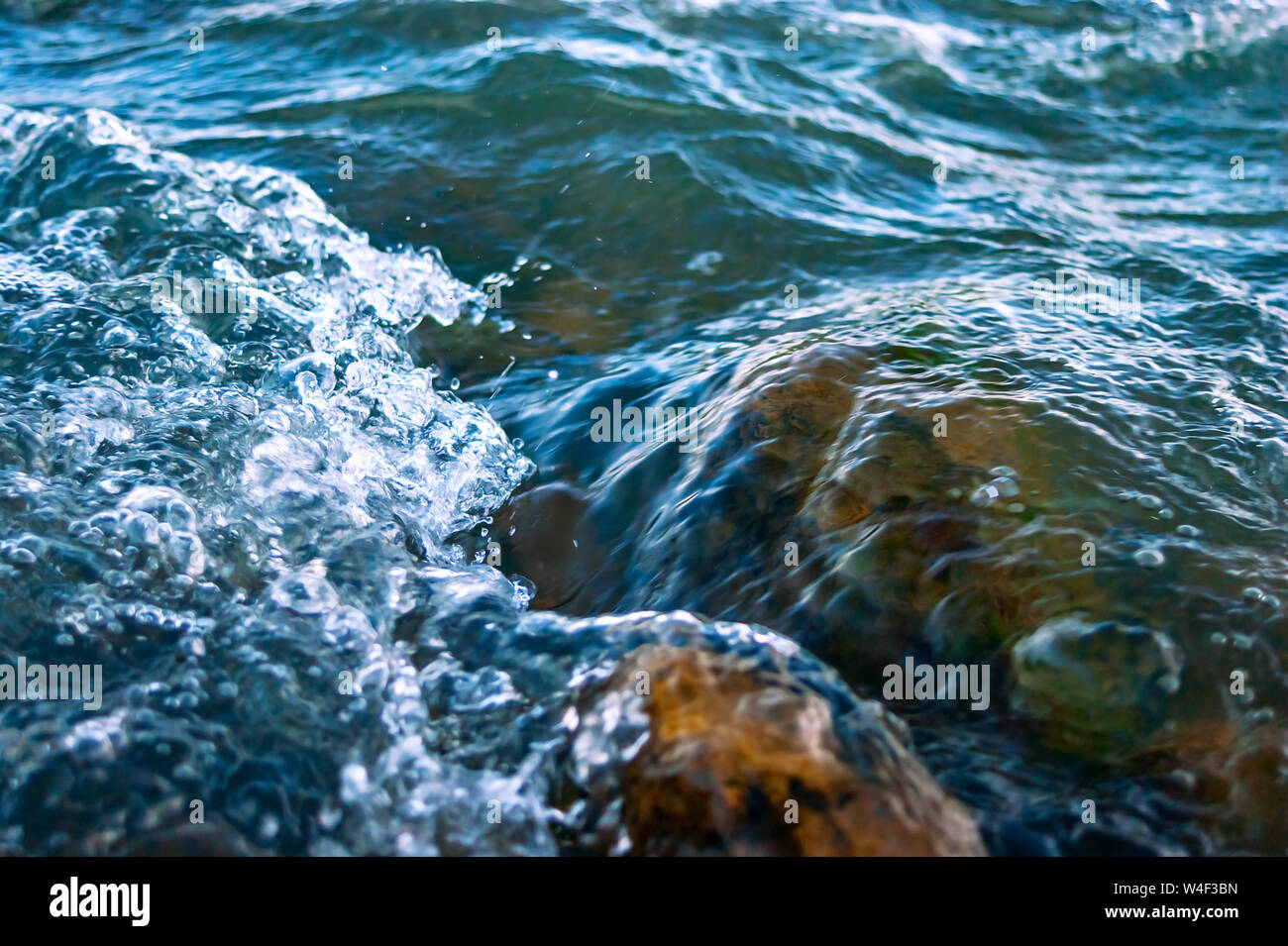 Water splashes over rocks hi-res stock photography and images - Alamy
