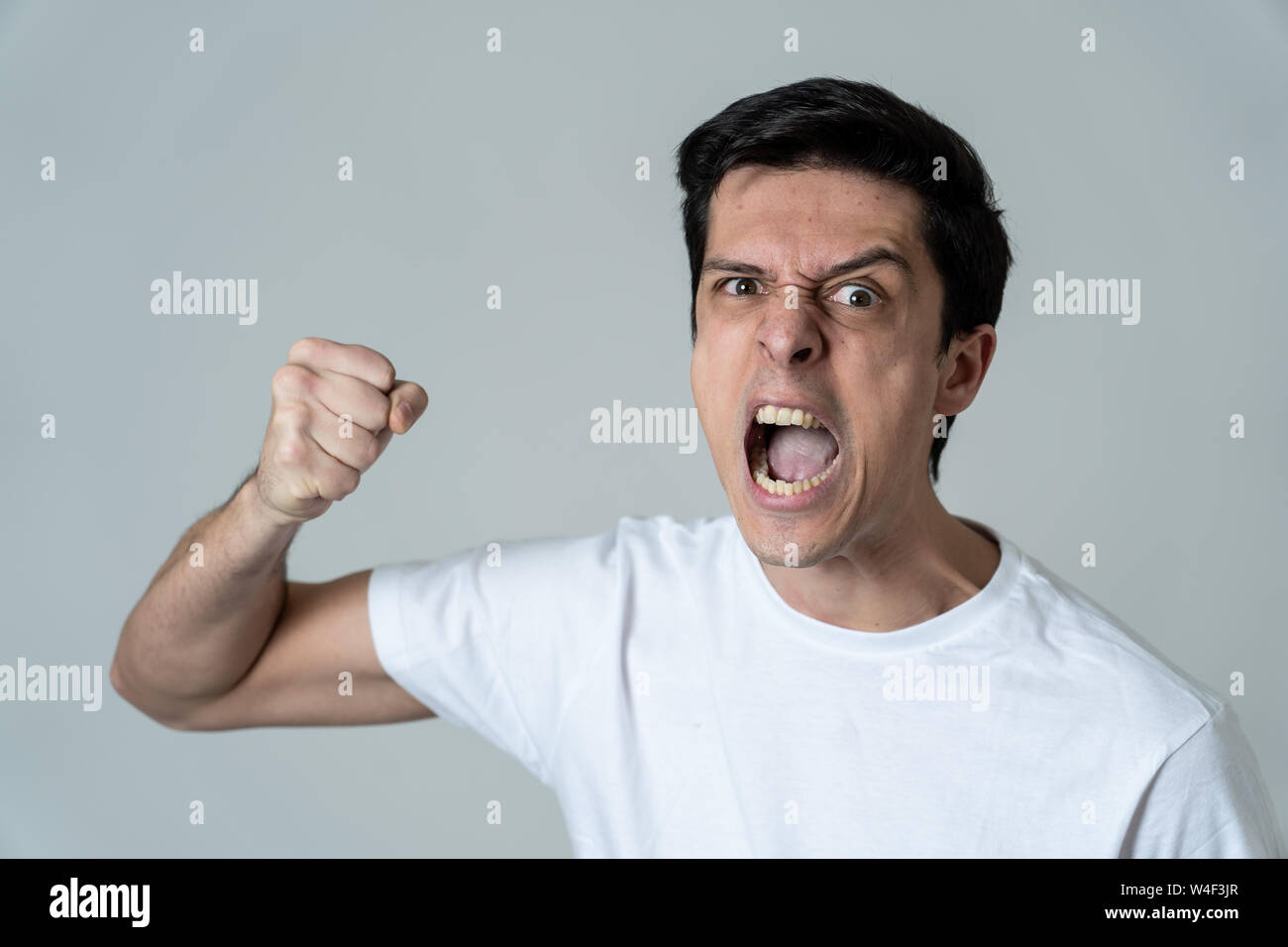 Close up of young caucasian male with an angry face. Looking mad, crazy ...