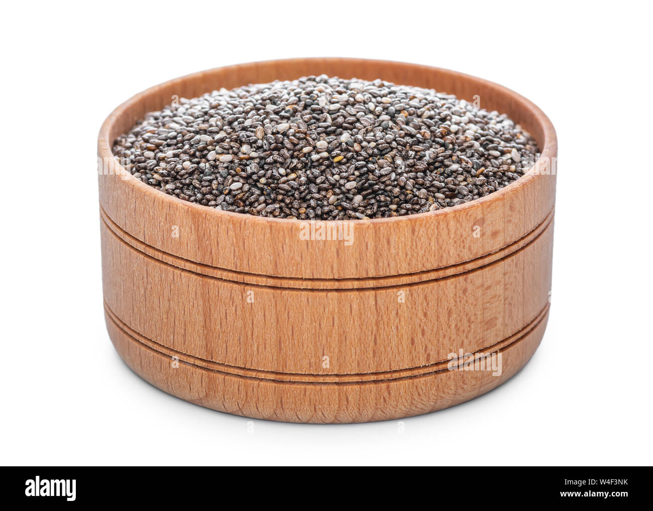 dry chia seeds in natural wooden pot isolated on white background ...