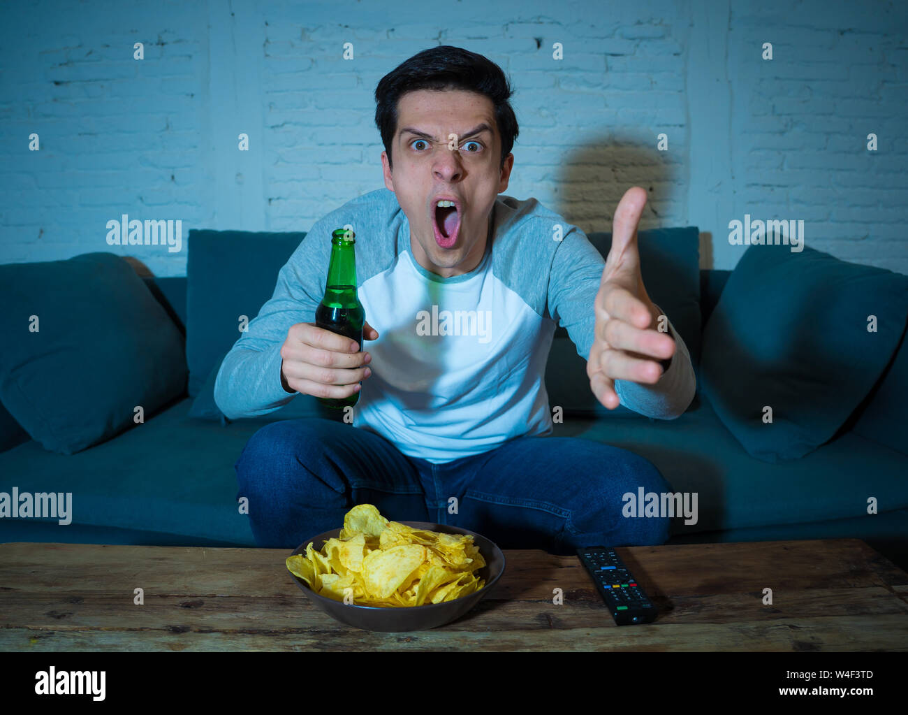 Male tv drink remote hi-res stock photography and images - Alamy