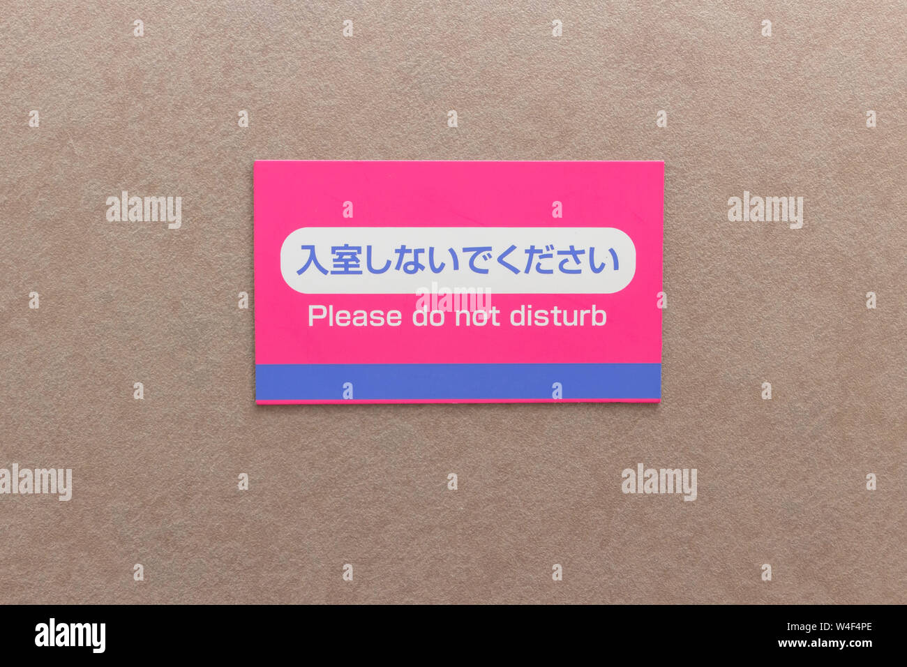Door of hotel room with sign do not disturb(Japanese and English Stock ...