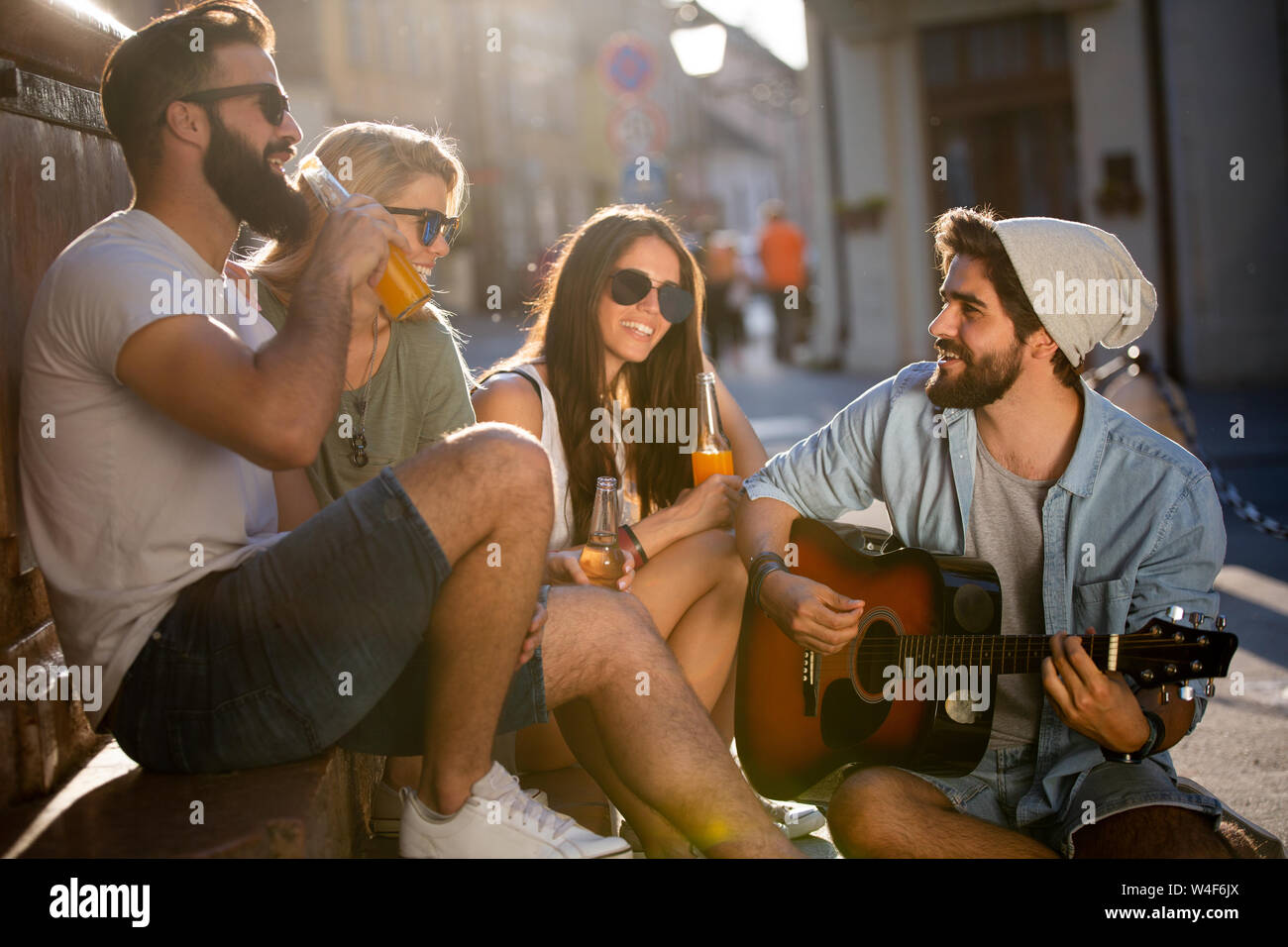 Group of friends hanging out, having fun and enjoying summer days Stock ...
