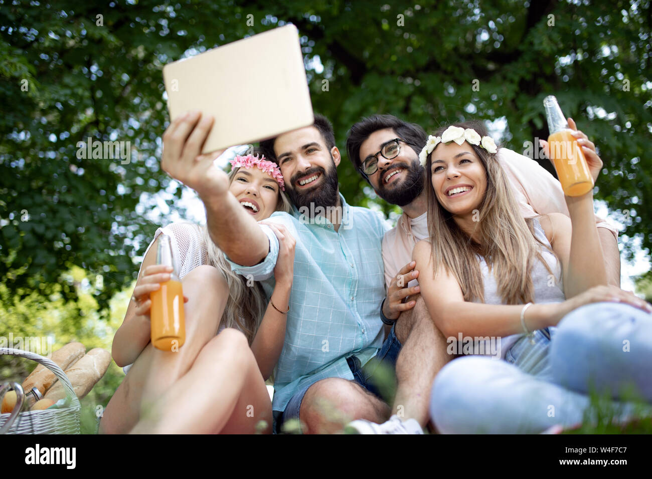 Happy young friends having fun outside in nature, taking selfie Stock ...
