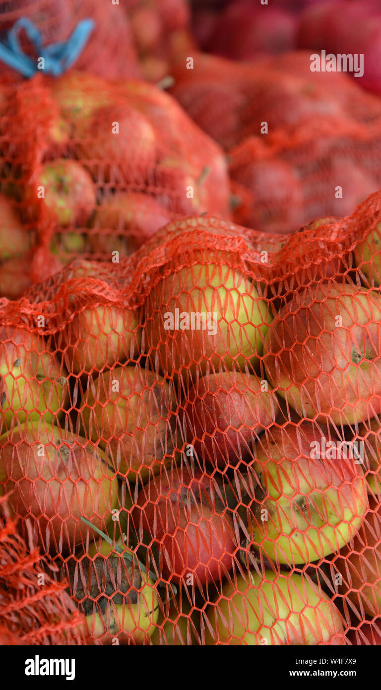 industrial apples in a mesh bag Stock Photo - Alamy