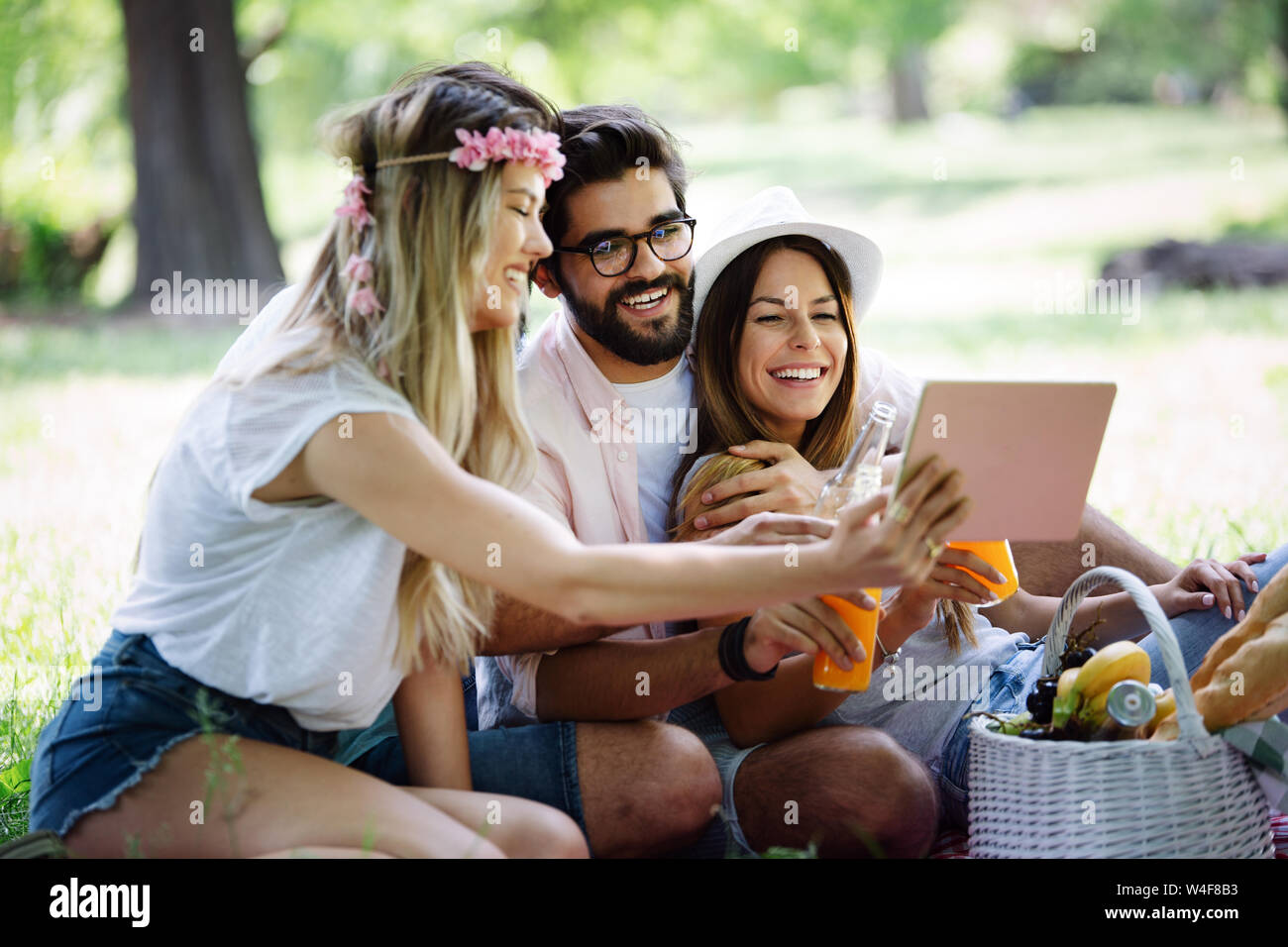 Happy young friends having fun outside in nature, taking selfie Stock ...