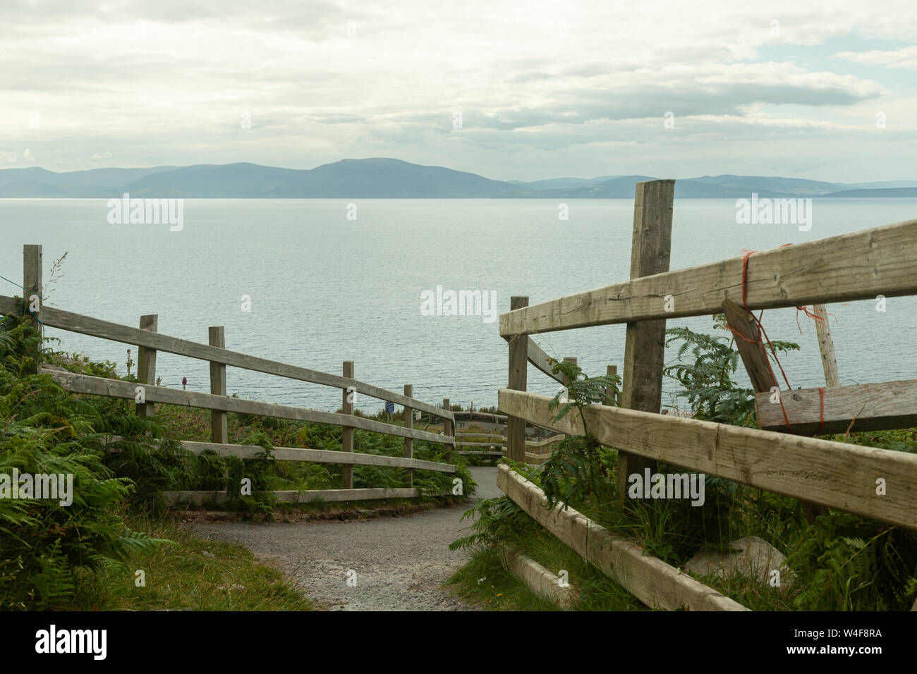 path lined by wood fencing Stock Photo - Alamy