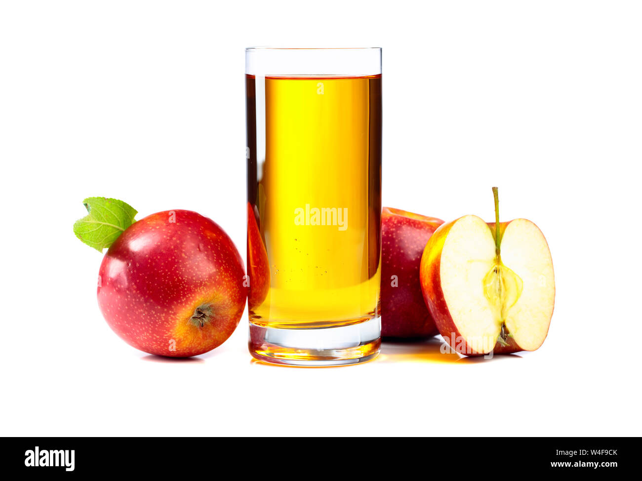 Glass of apple juice and juicy red apples isolated on a white ...