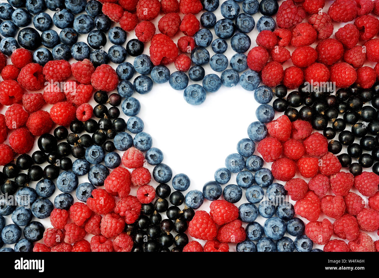 Summer blueberry, raspberries and currant heart frame detox isolated on ...
