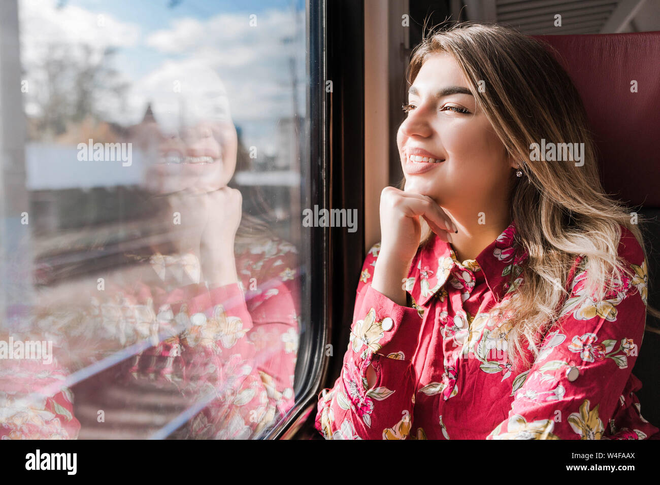 Girl sitting alone in train hi-res stock photography and images - Alamy