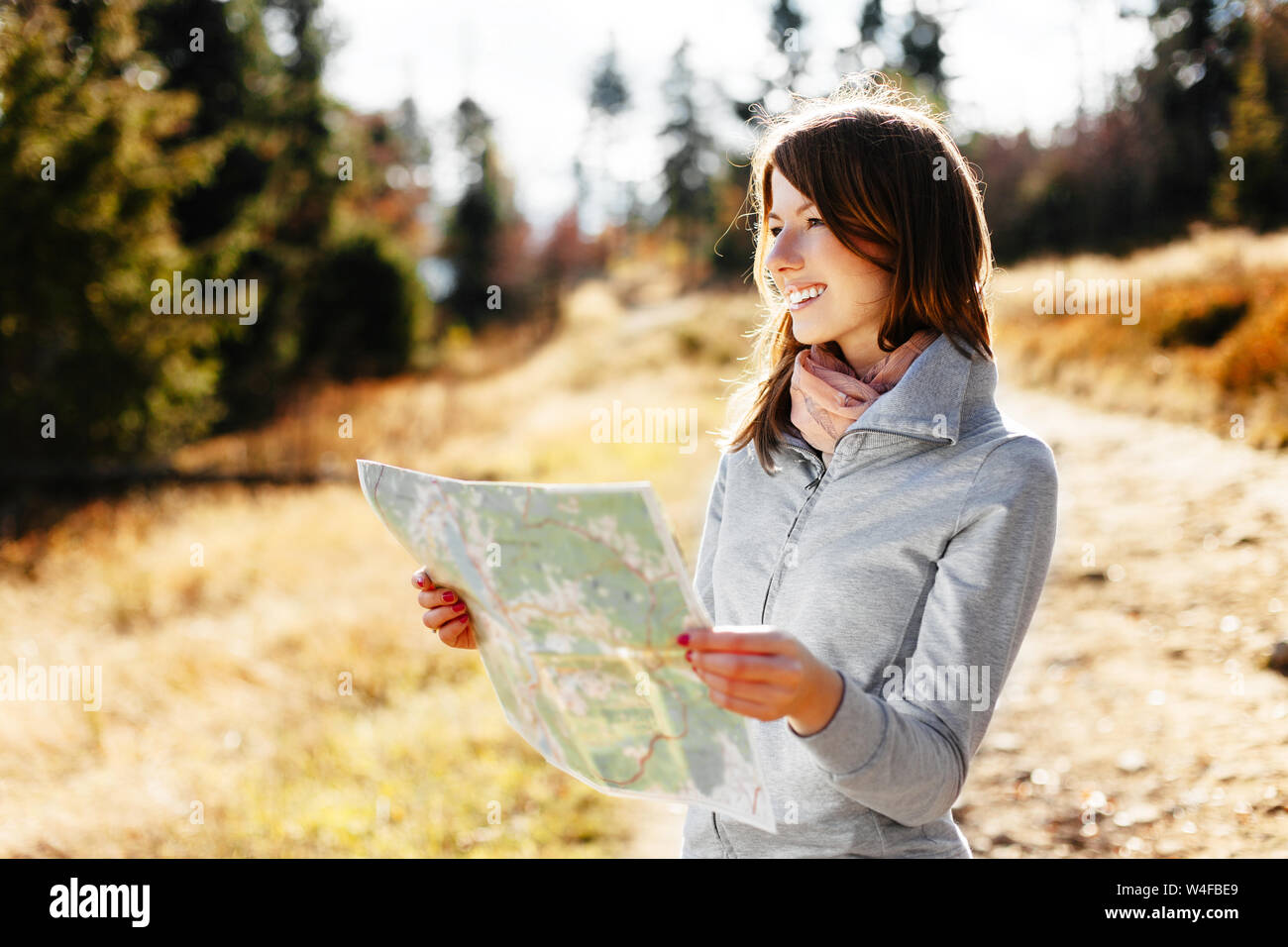 One woman map reading hi-res stock photography and images - Alamy